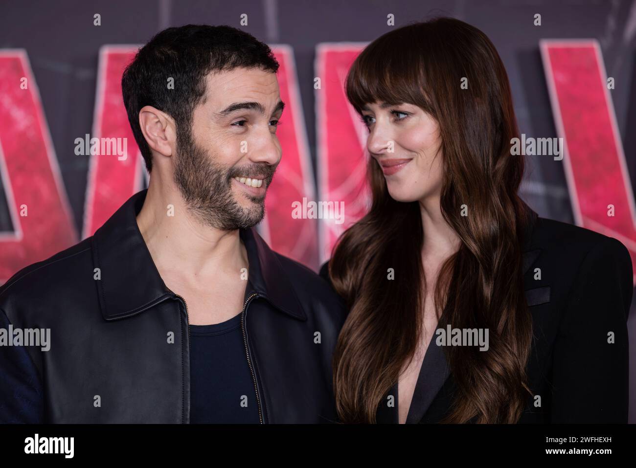 Tahar Rahim, left and Dakota Johnson pose for photographers during a ...