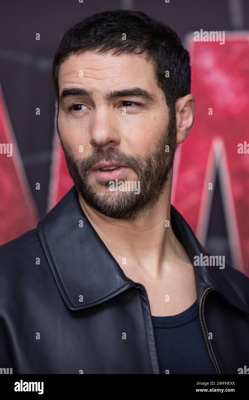 Tahar Rahim, left and Dakota Johnson pose for photographers during a ...