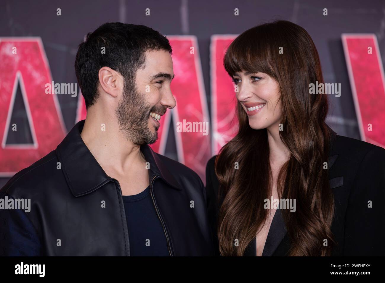 Tahar Rahim, left and Dakota Johnson pose for photographers during a ...
