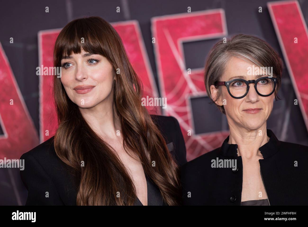 Dakota Johnson and S.J. Clarkson pose for photographers during a photo ...