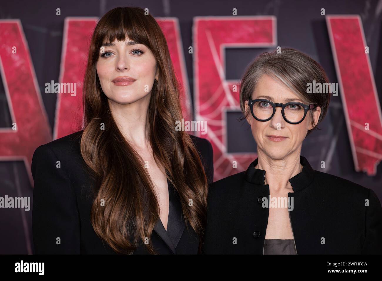 Dakota Johnson and S.J. Clarkson pose for photographers during a photo ...