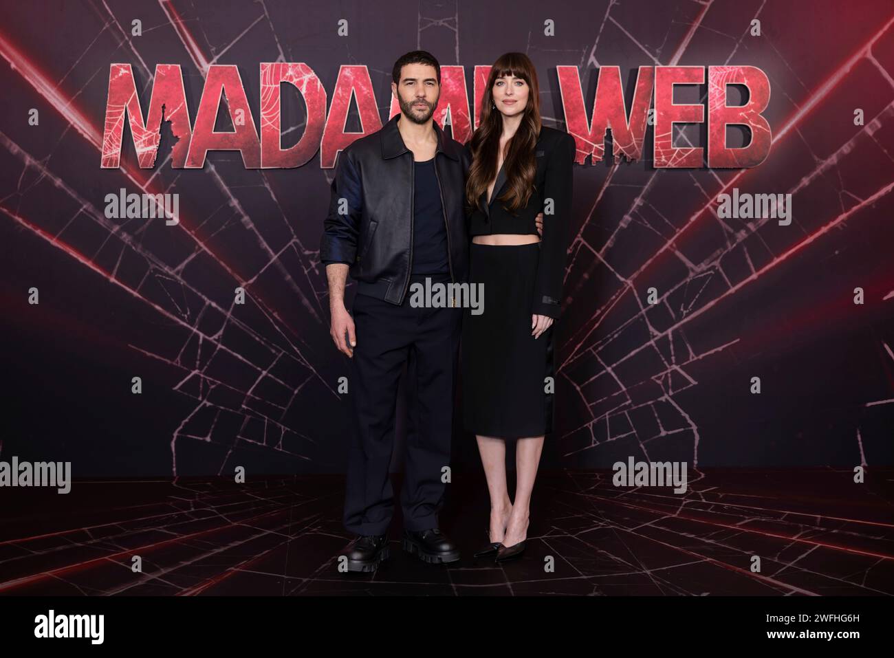 Tahar Rahim, left and Dakota Johnson pose for photographers during a ...