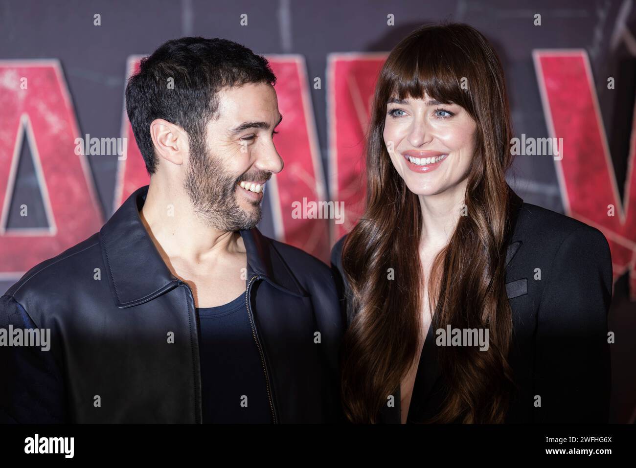 Tahar Rahim, left and Dakota Johnson pose for photographers during a ...