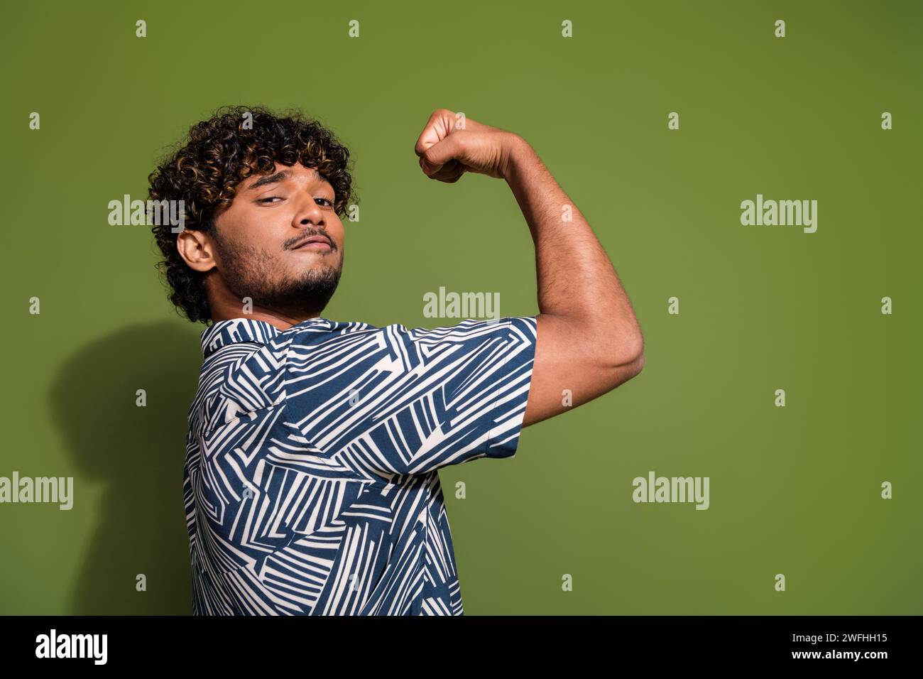 Profile photo of young amazing strength student raised fist up huge ...
