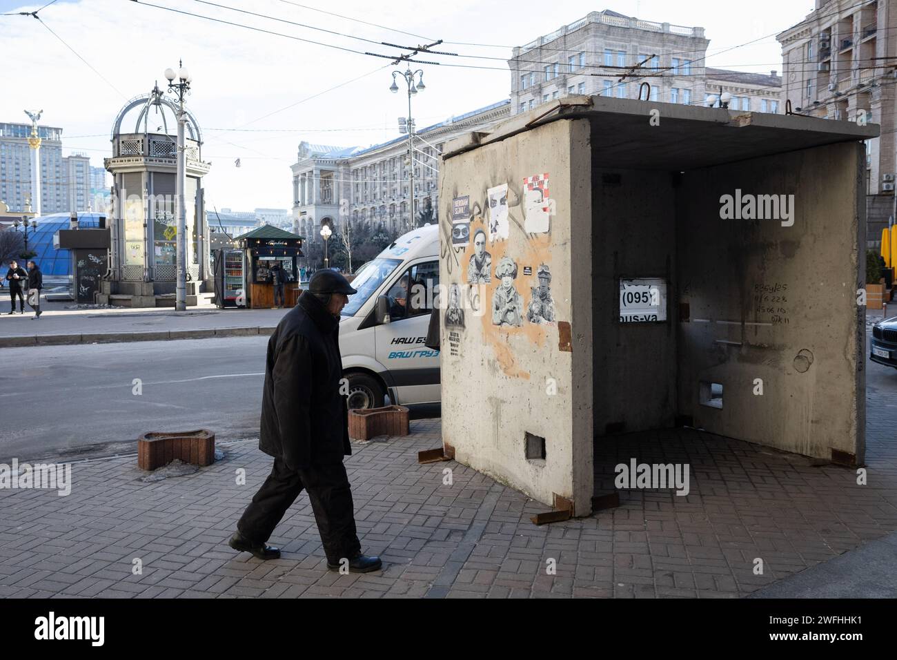 Kyiv, Ukraine. 30th Jan, 2024. A man walks near a concrete shelter from ...