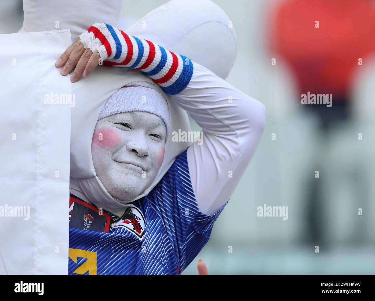 Doha, Qatar. 31st Jan, 2024. A supporter of Japan cheers for the team ...