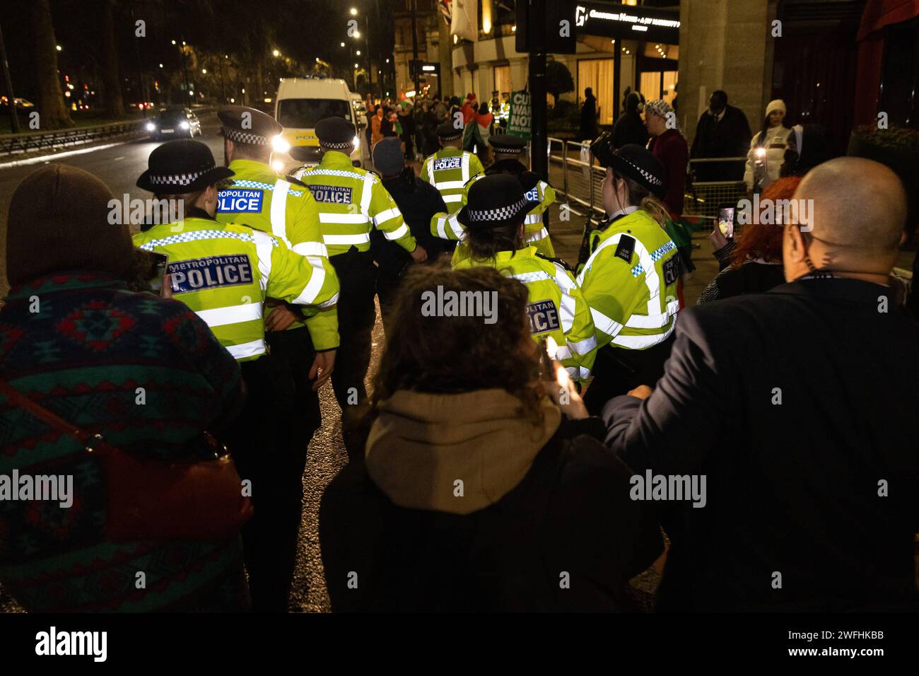 London, UK. 30th January, 2024. Metropolitan Police officers arrest a ...