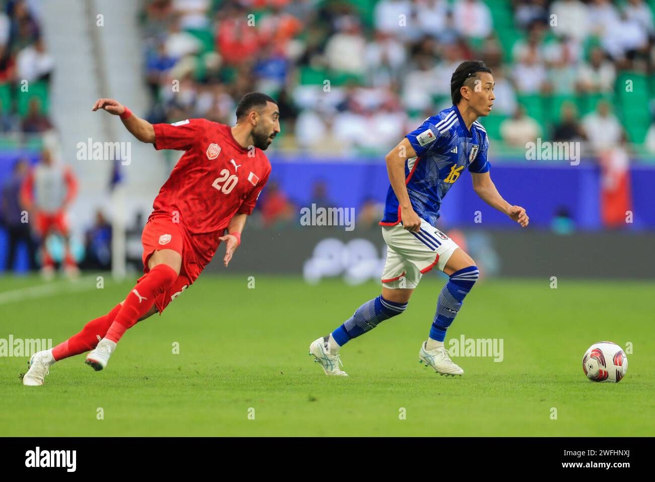 Bahrain's Mahdi Humaidan, left, and Japan's Seiya Maikuma compete ...