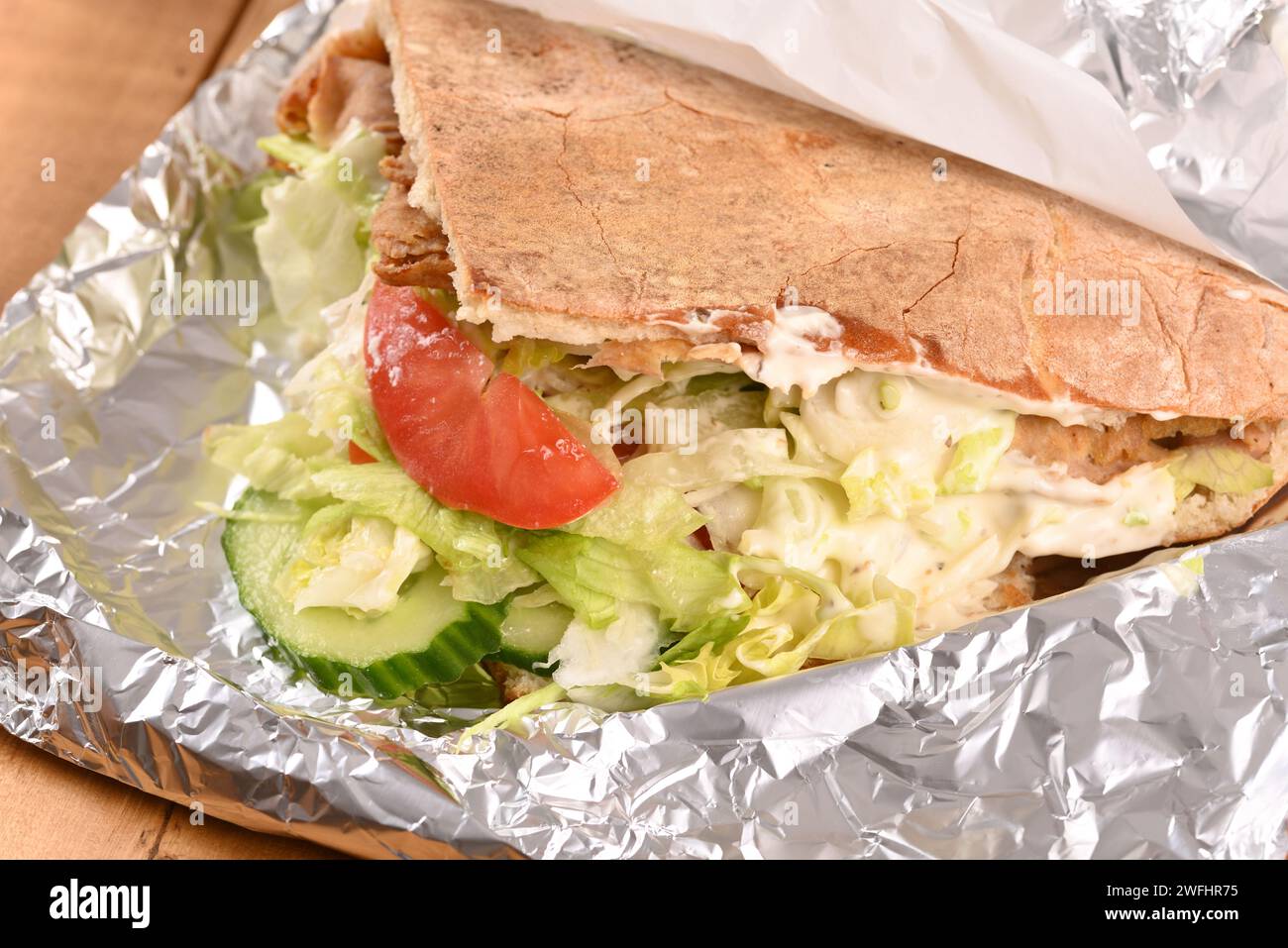 Doner kebab on aluminum foil, close up Stock Photo - Alamy