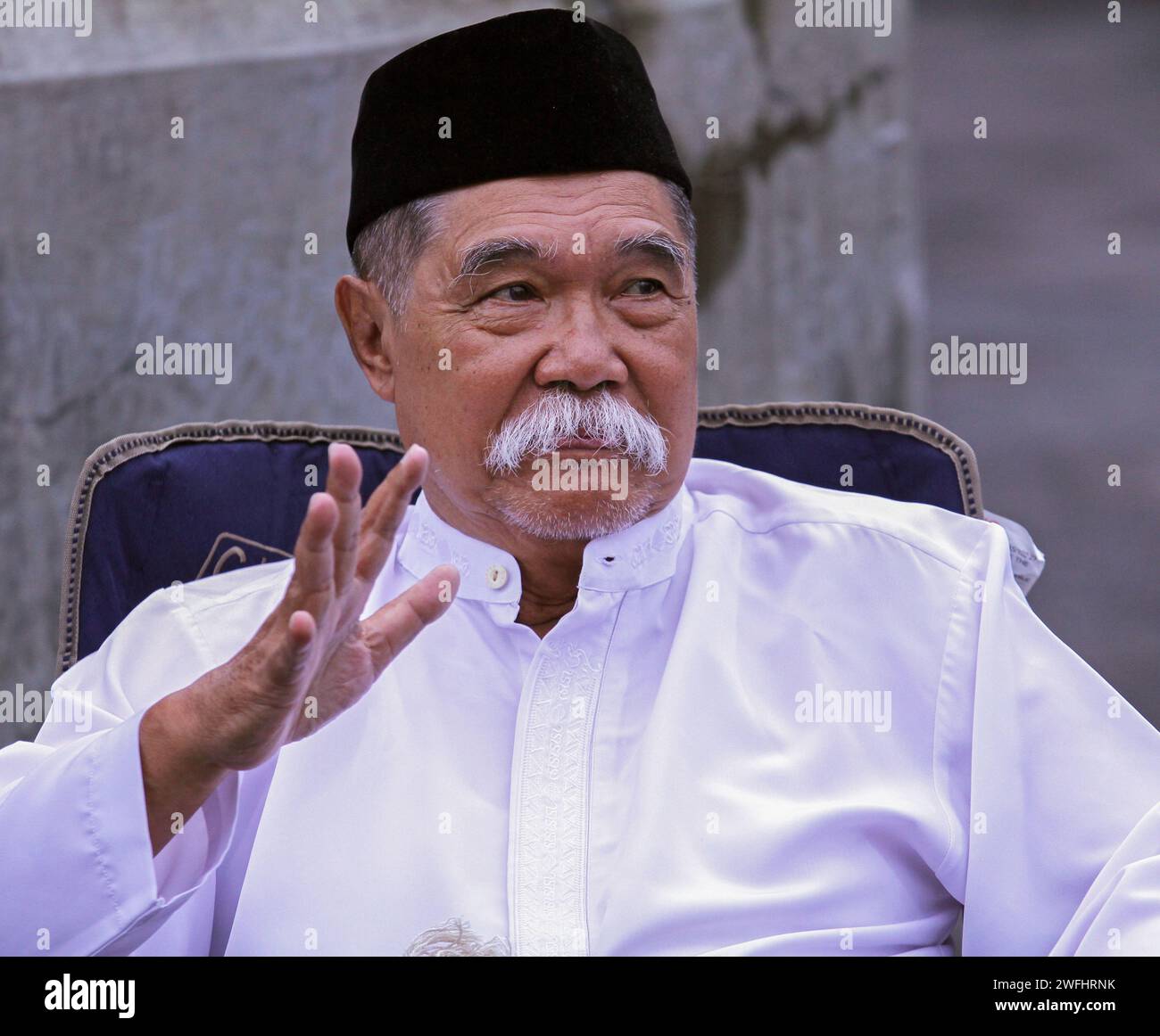 A senior Muslim man with a big moustache in Bandung, West Java ...