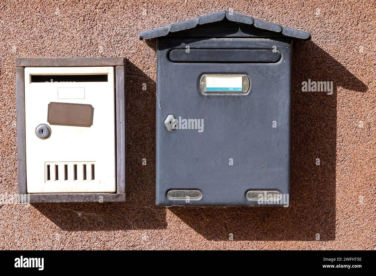 Metal closed post boxes outside on a building facade Stock Photo - Alamy