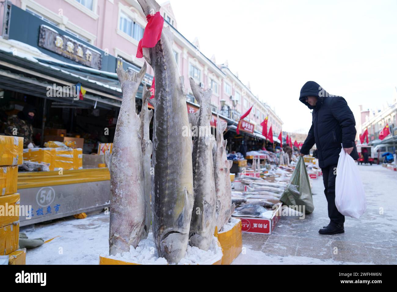 Fuyuan, China's Heilongjiang Province. 31st Jan, 2024. A customer buys ...