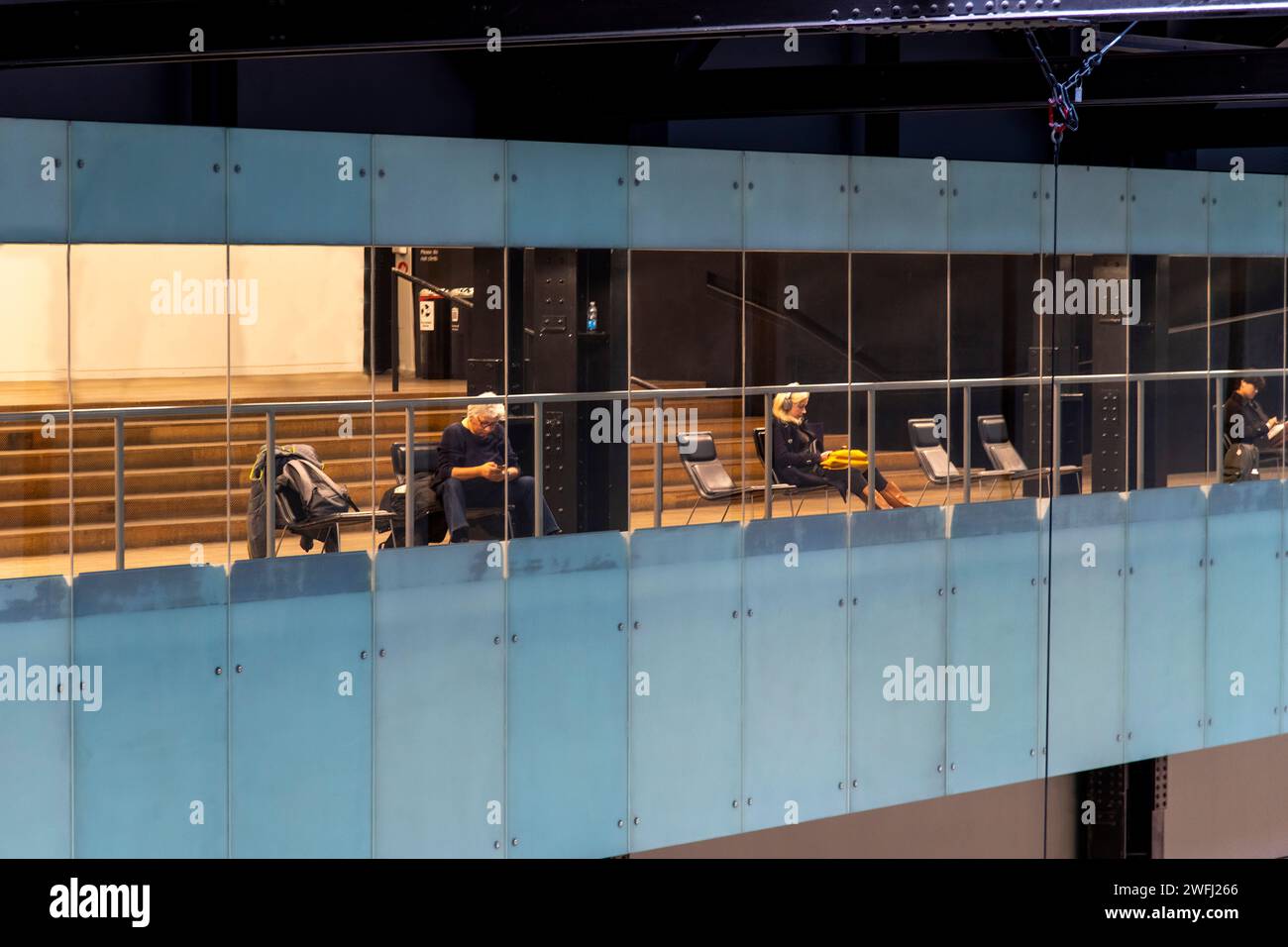London, UK-December 14, 2023; Glass visitor gallery with people of the ...
