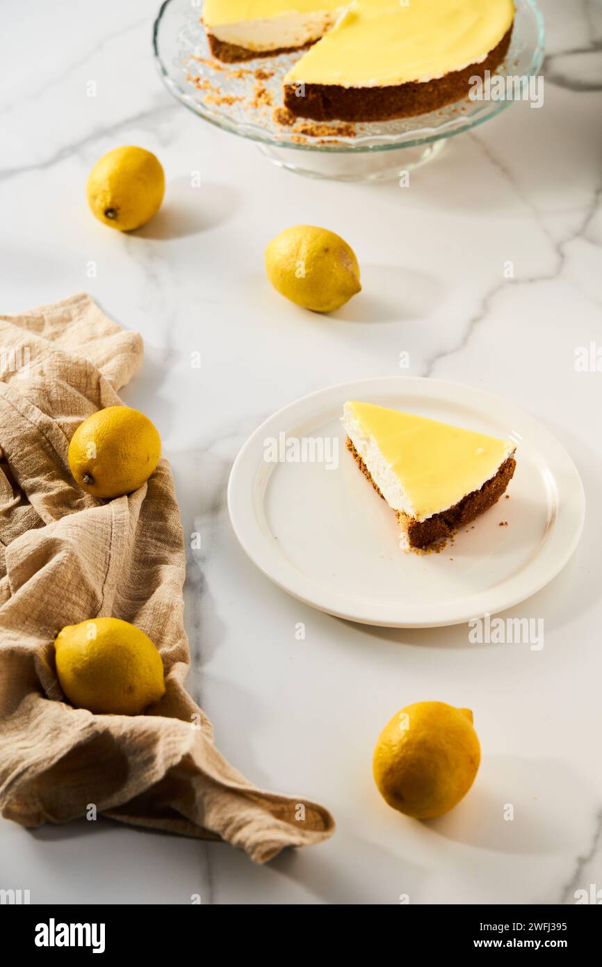 Mascarpone cheesecake with lemon curd and shortbread base. White marble ...