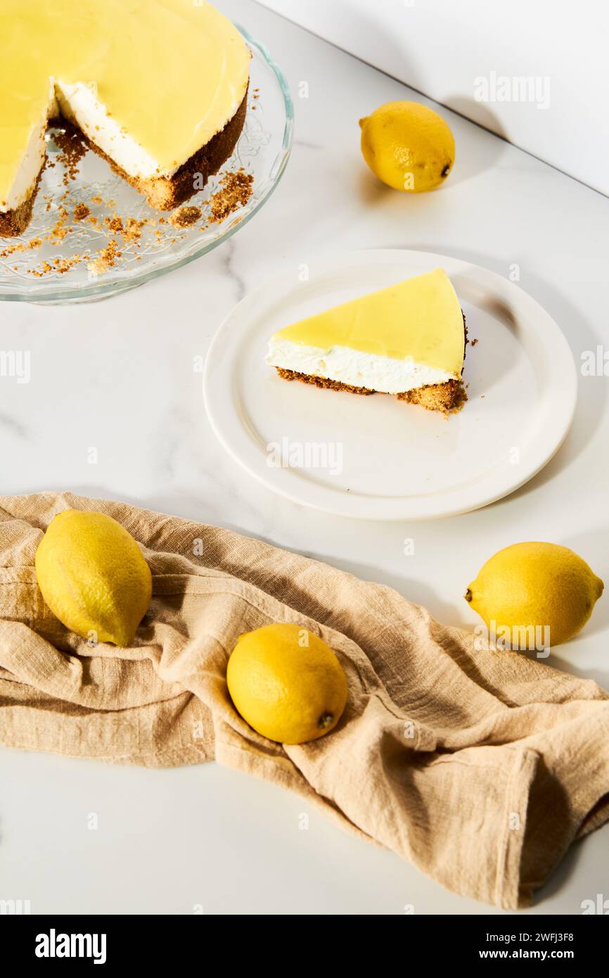 Mascarpone cheesecake with lemon curd and shortbread base. White marble ...