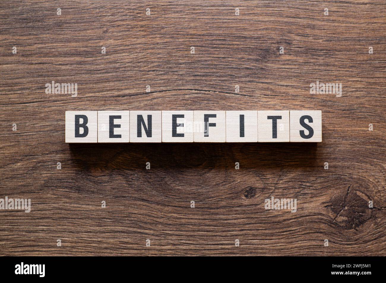 Benefits - word concept on building blocks, text Stock Photo - Alamy