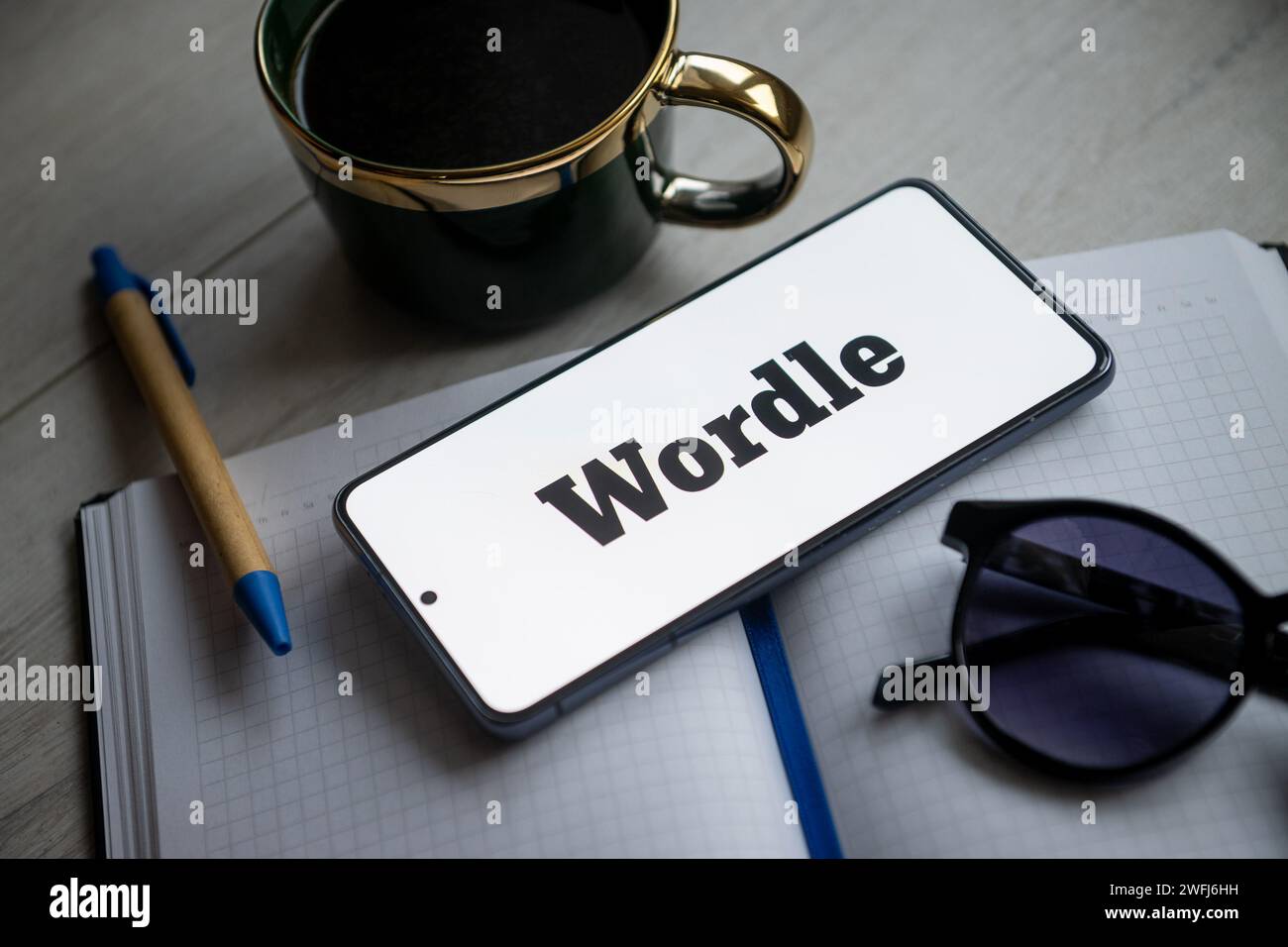 In this photo illustration a Wordle logo seen displayed on a smartphone ...