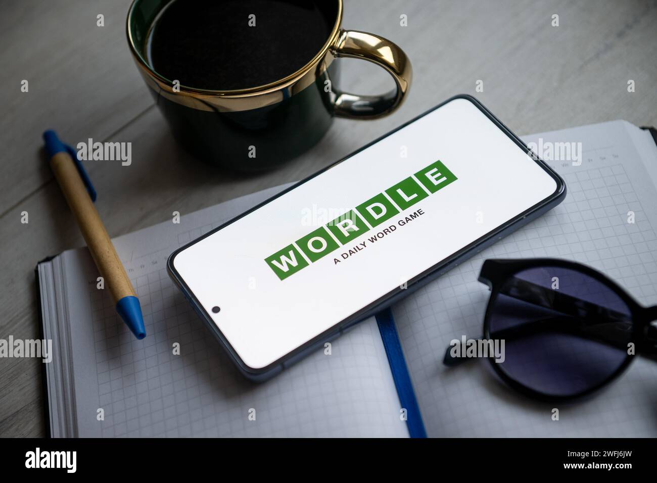 In this photo illustration a Wordle logo seen displayed on a smartphone ...