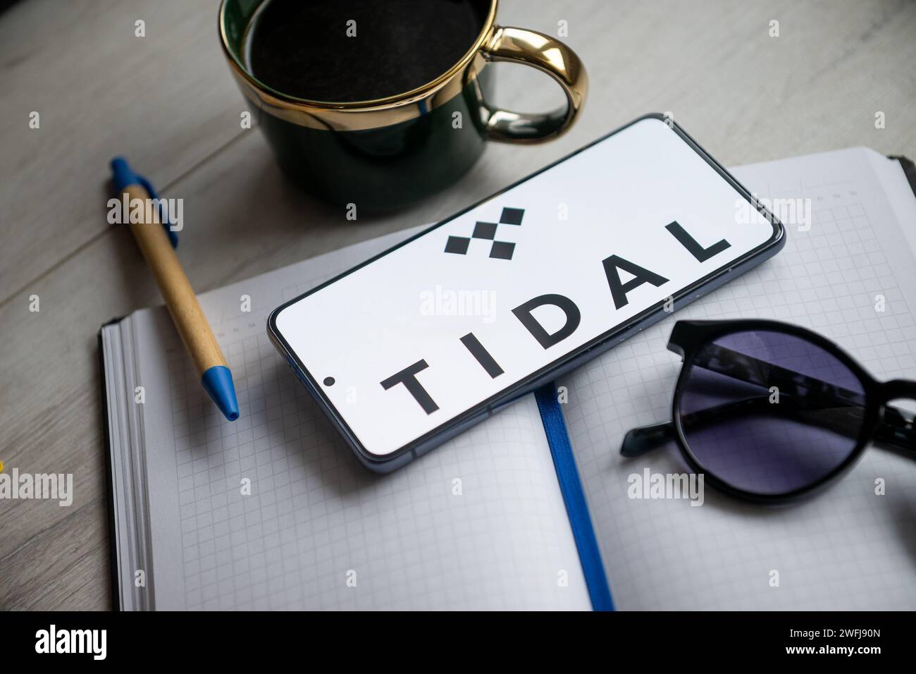 In this photo illustration a Tidal logo seen displayed on a smartphone ...
