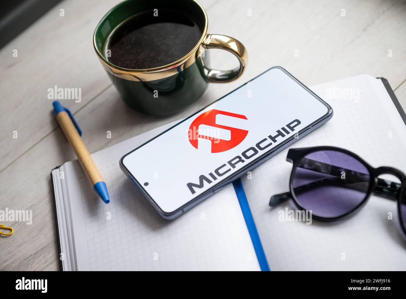 In this photo illustration a Microchip logo seen displayed on a ...