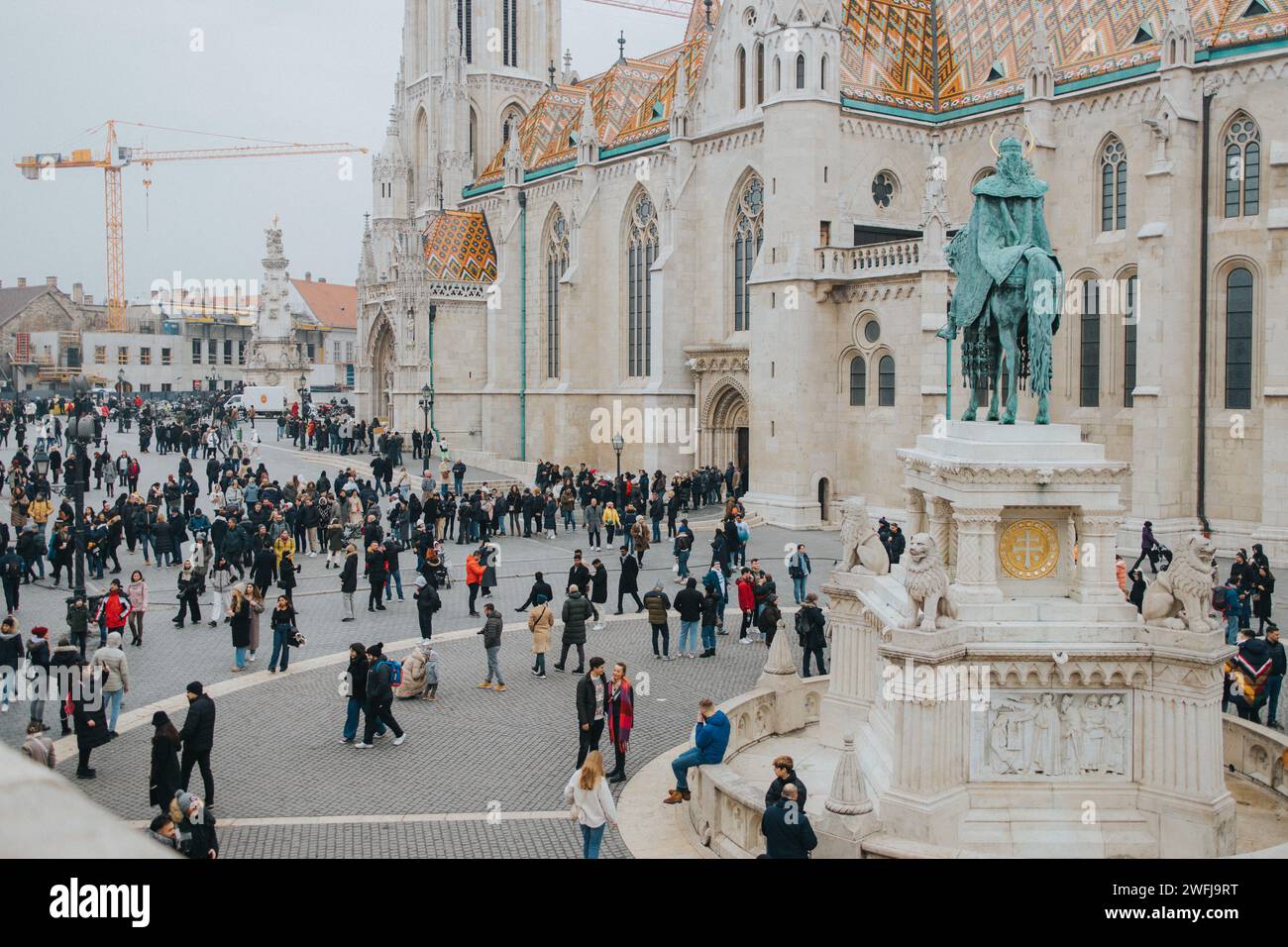 crowd of people is gathered in front of a majestic architectural ...