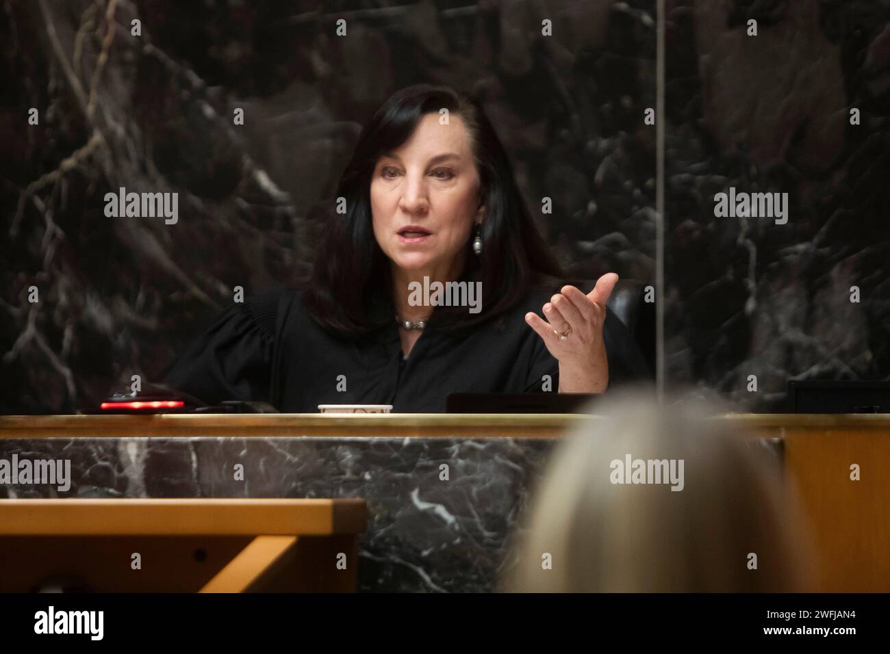 Judge Cheryl Matthews speaks with attorneys during a jury trial for ...
