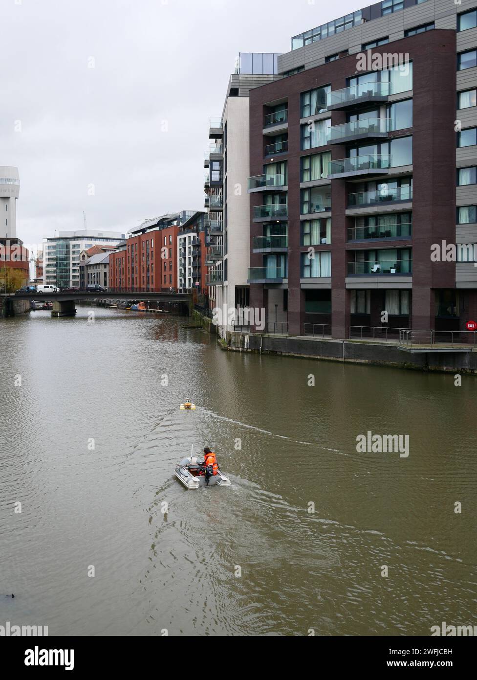 Surveyor using small RIB boat follows remote piloted Sonar survey craft ...