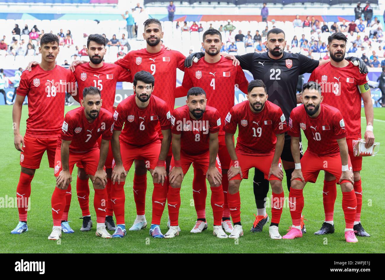 Doha, Qatar. 31st Jan, 2024. Bahrain's starting players pose for group ...