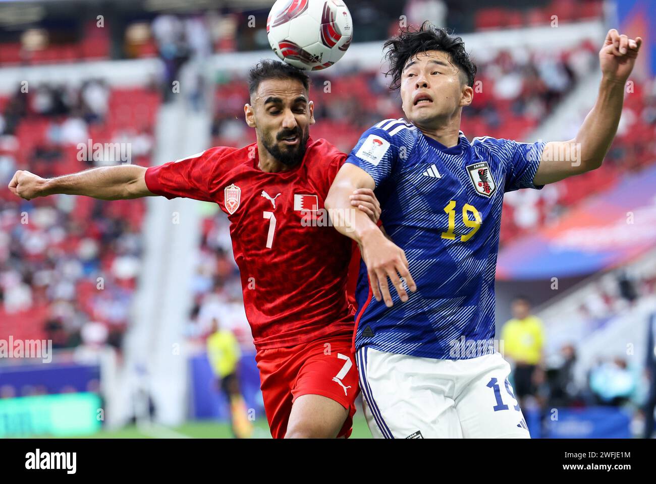 Doha, Qatar. 31st Jan, 2024. Japan's Nakayama Yuta (R) vies with ...