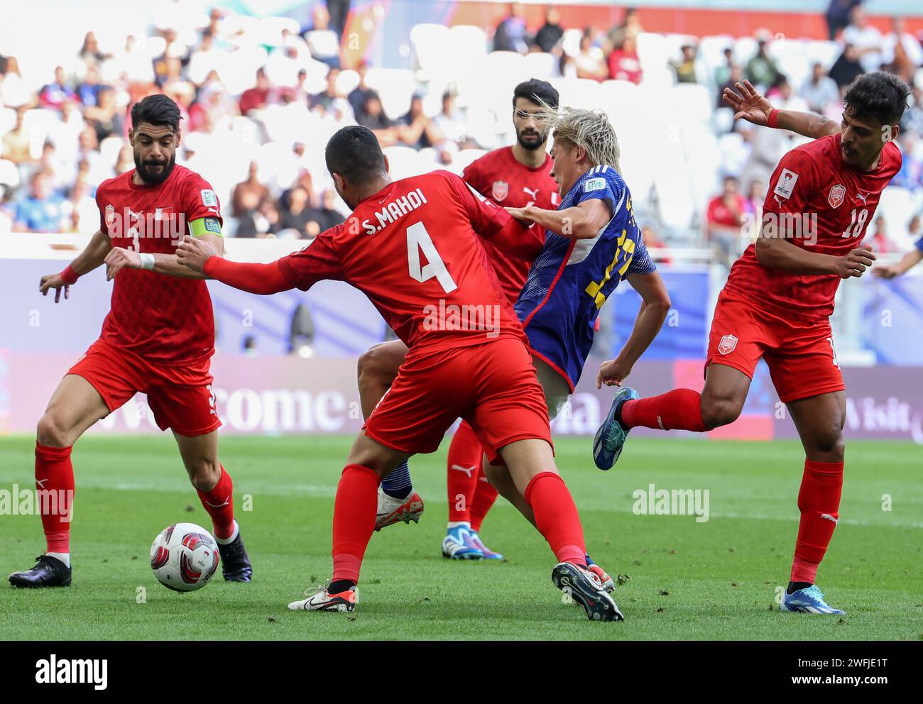 Doha, Qatar. 31st Jan, 2024. Japan's Nakamura Keito (2nd R) vies for ...