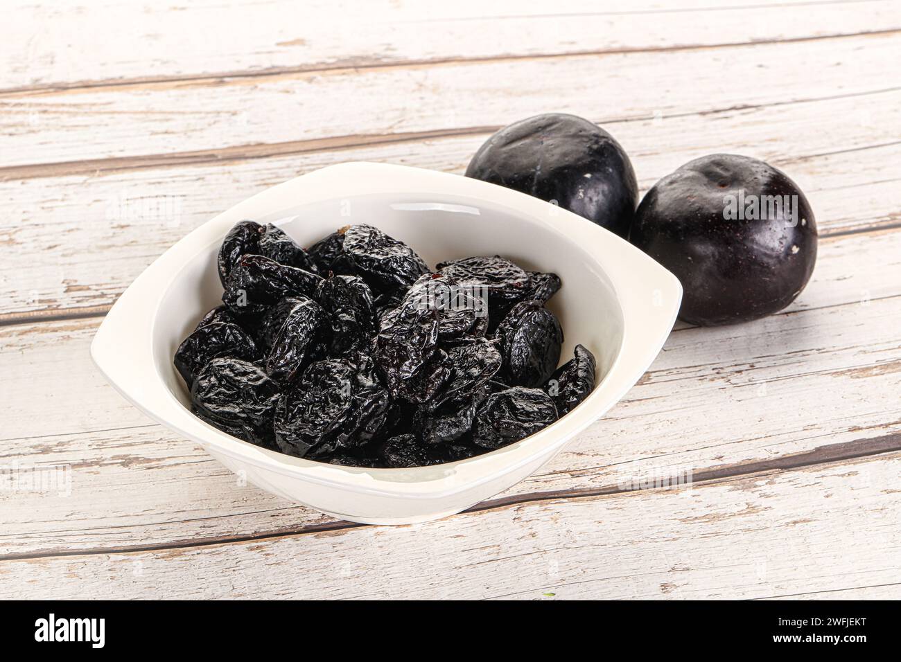 Dry sweet prunes in thw bowl Stock Photo - Alamy