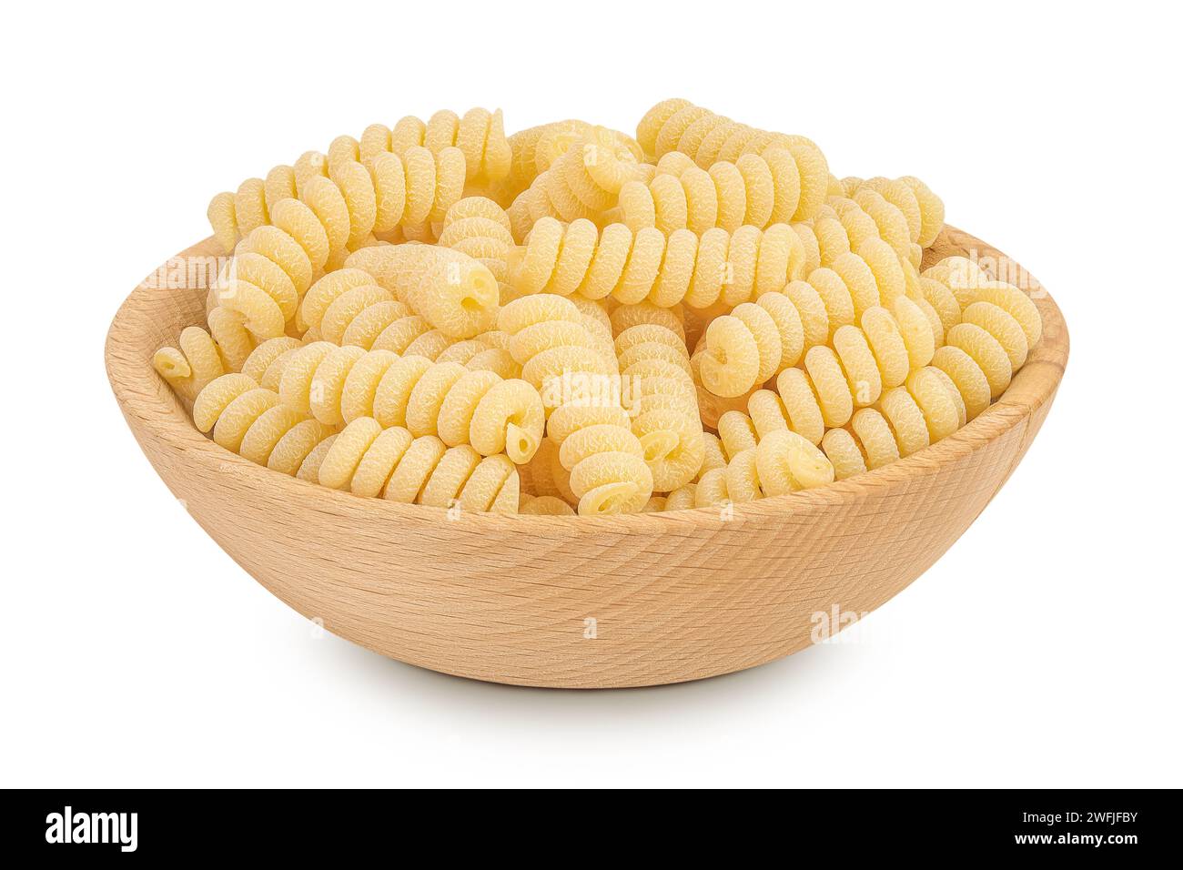 Italian spiral shaped pasta, Fusilli bucati macaroni in wooden bowl ...