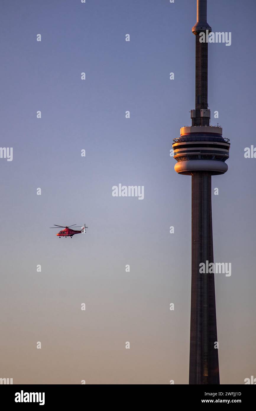 A Close up of the CN Tower as a helicopter flies by - Toronto, Ontario ...