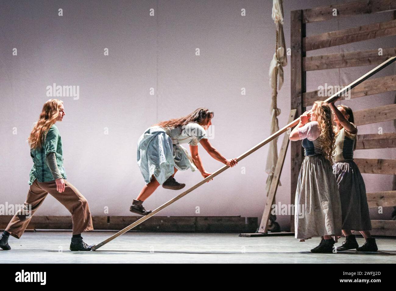 London, UK. 31st Jan, 2024. The ensemble of performers in a scene ...