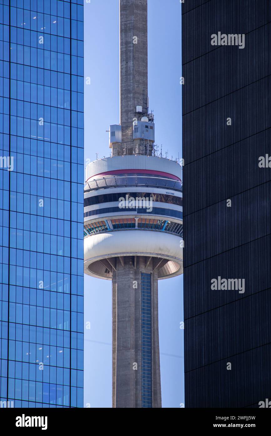 A Close up of the CN Tower between two buildings - Toronto, Ontario ...