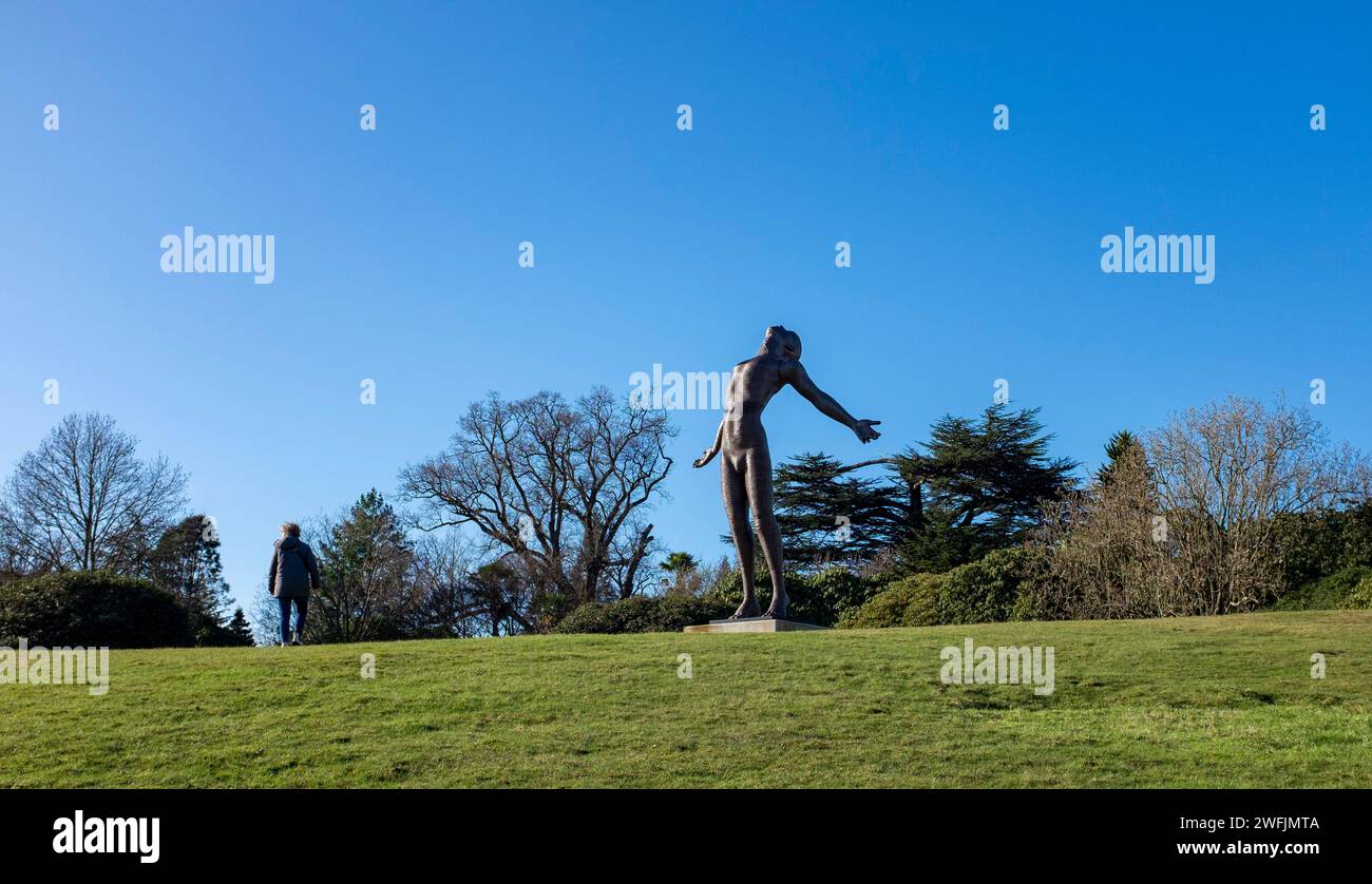 A visitor looking at the large 'Faith' sculpture by Anton Smit at ...