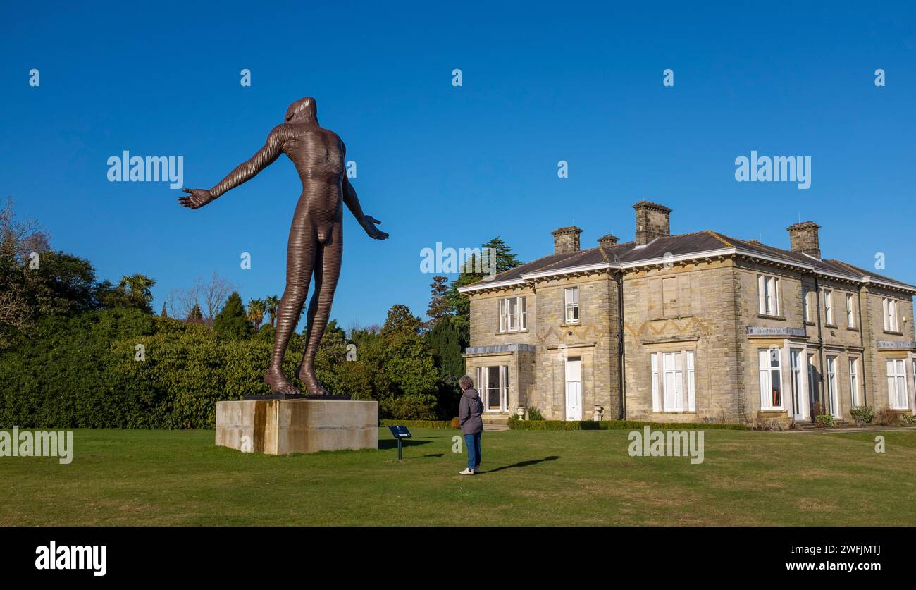 A visitor looking at the large 'Faith' sculpture by Anton Smit at ...