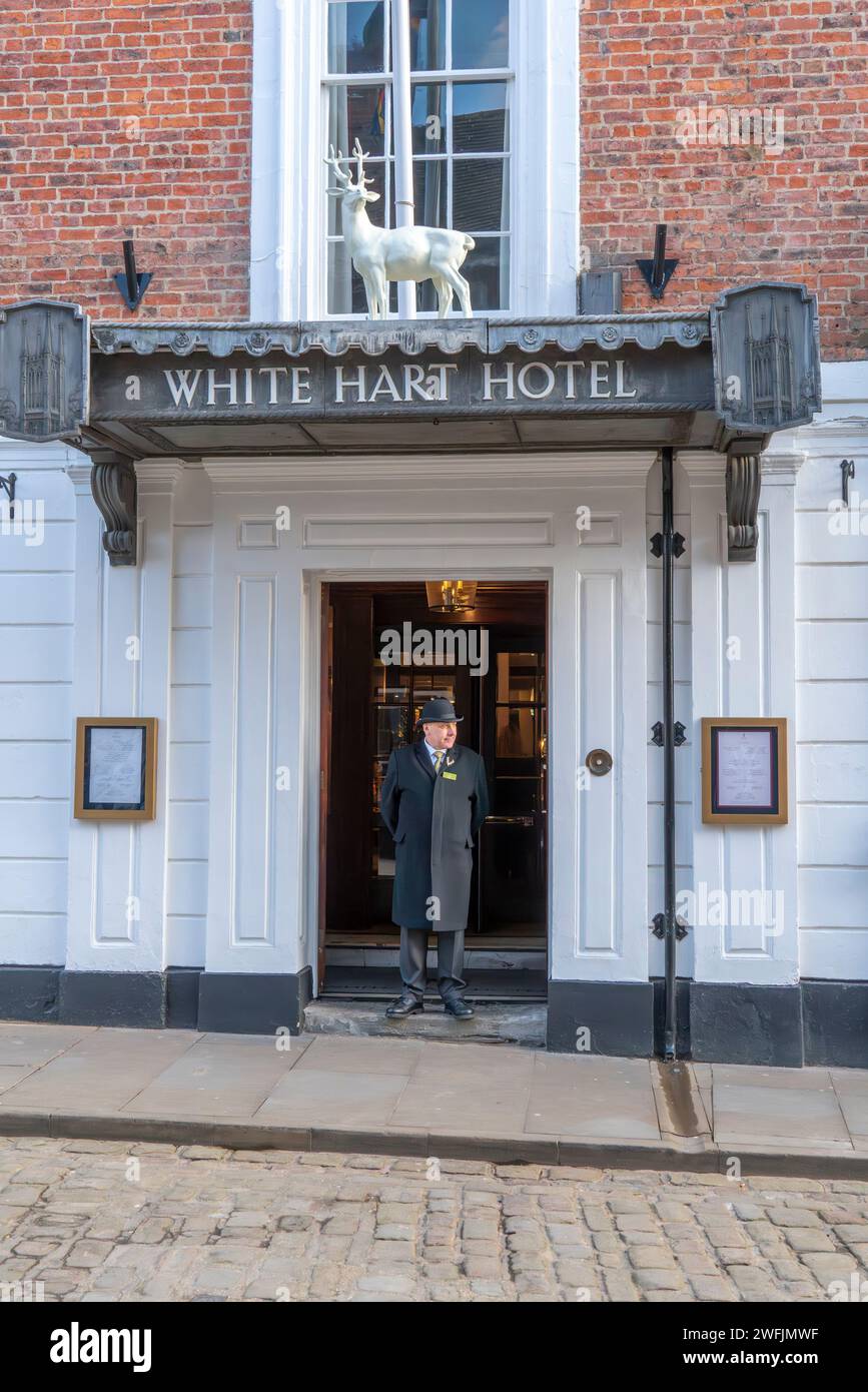 White Hart Hotel commissionaire standing in doorway to weclome visitors ...