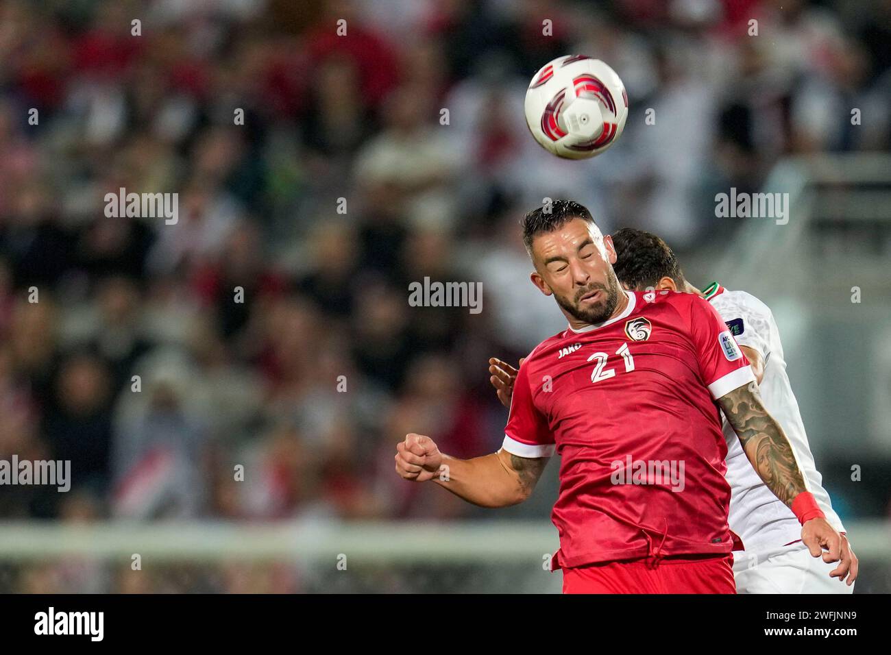 Syria's Ibrahim Hesar, front, jumps for the ball with Iran's Shoja ...