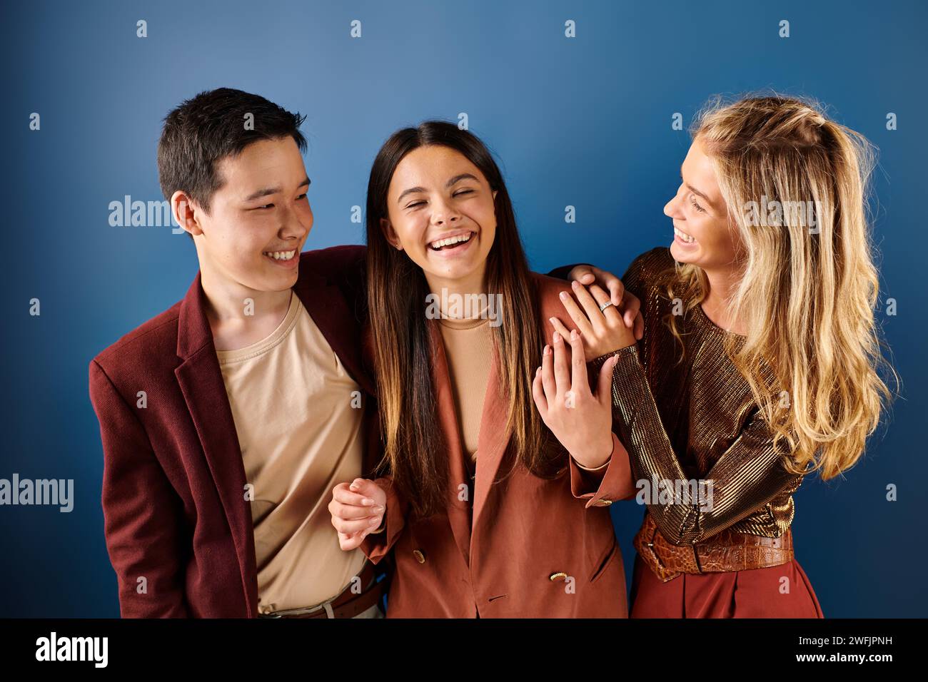 joyous diverse adolescents in vivid attires spending time together on ...