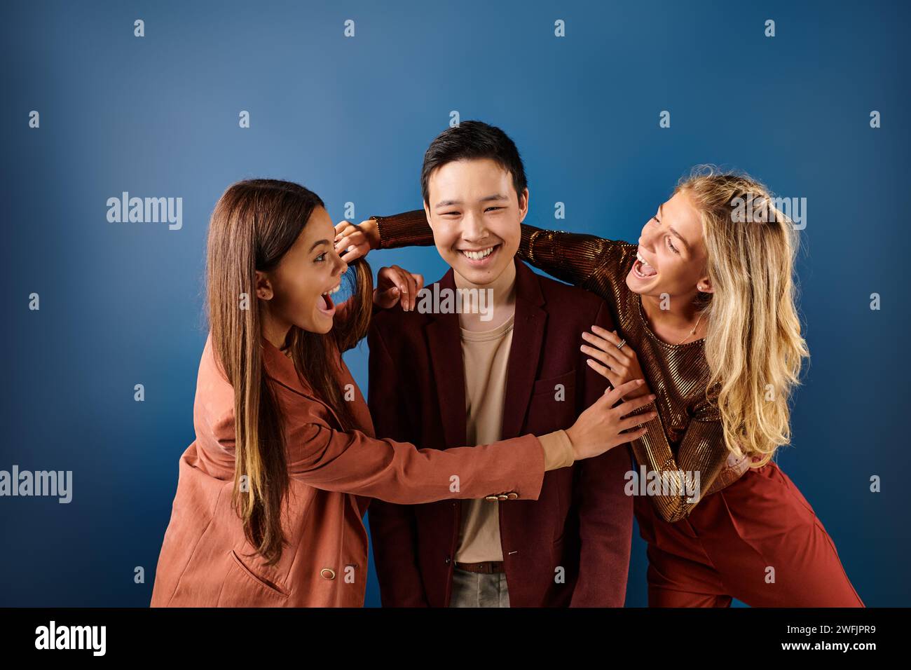 jolly teenage girls in vivid attires having fun with their asian ...