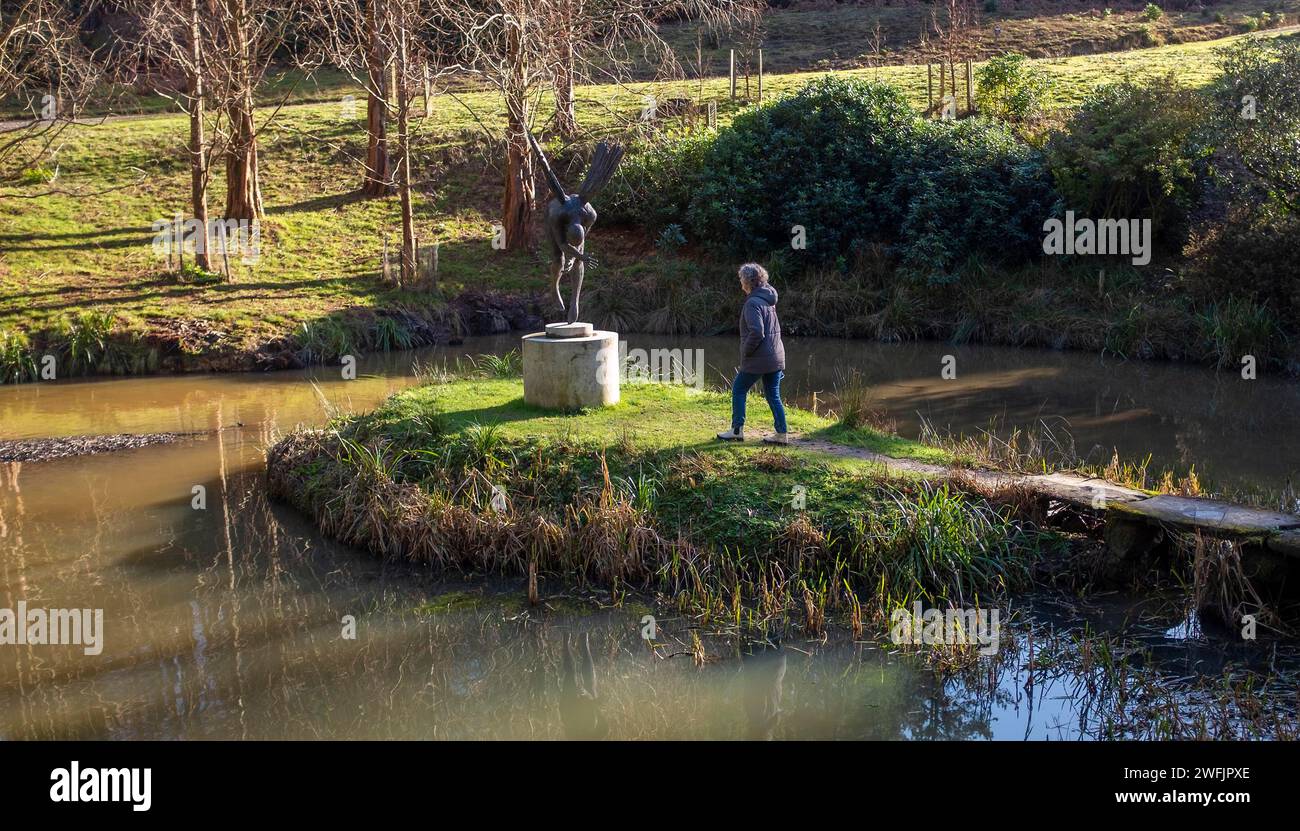 Visitor walking by some of the artwork at Leonardslee Gardens and ...