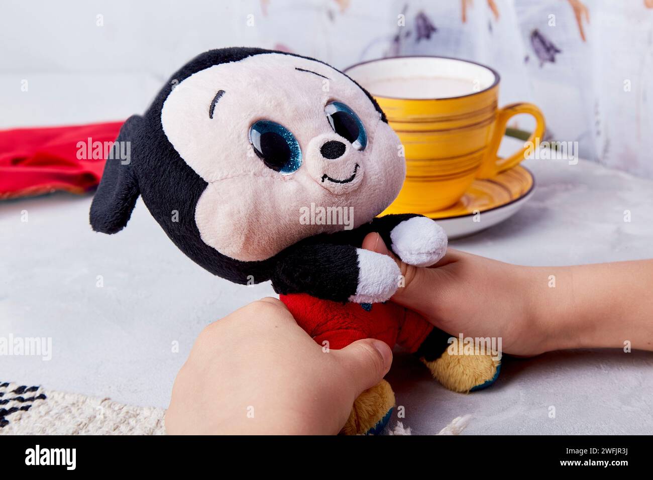 Kid plays with mickey mouse. Collectible disney magic in a toy Stock ...