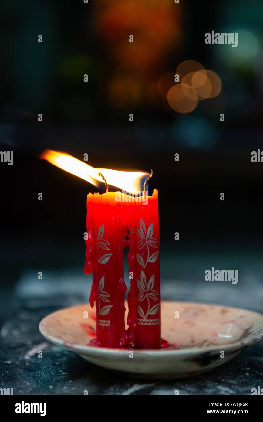 Red candles on altar in Buddhist temple in Vietnam Stock Photo - Alamy
