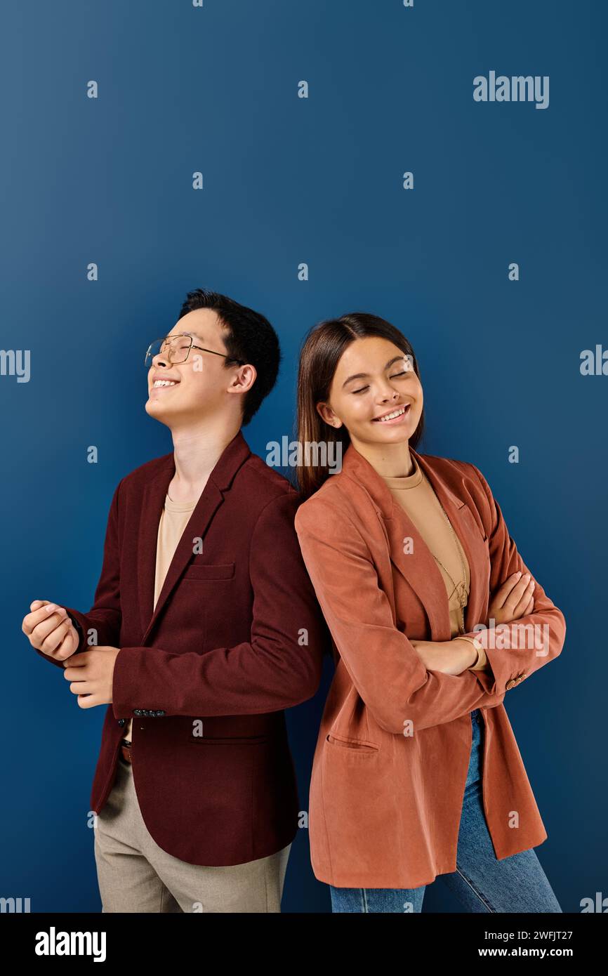 merry fashionable diverse adolescent boy and girl in elegant attires ...