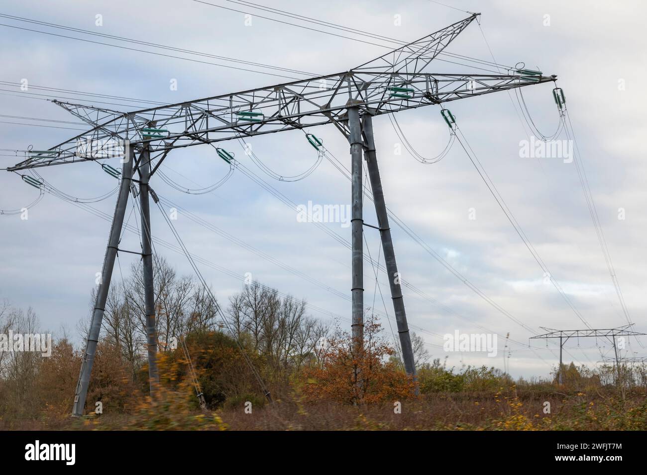 Oversized electricity pylons leaving a nuclear power station and going ...