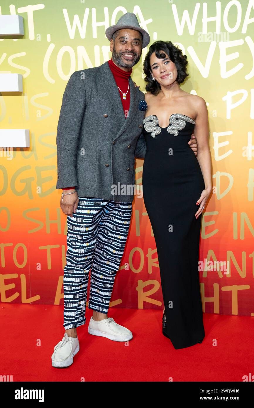 Karl Collins, left, and Umi Meyers pose for photographers upon arrival ...