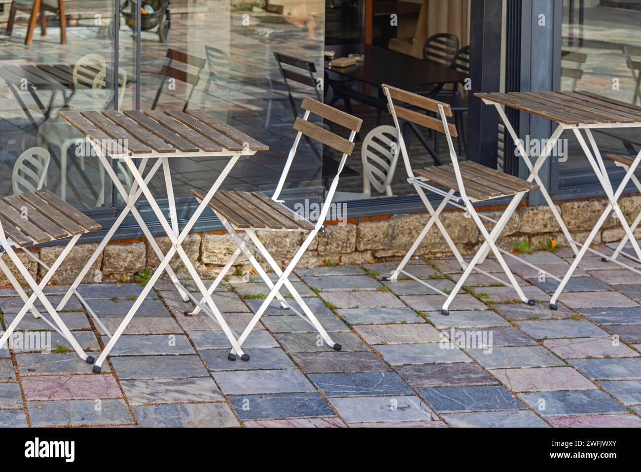 Tables and Chairs in Front of Coffee Shop at Street Stock Photo - Alamy