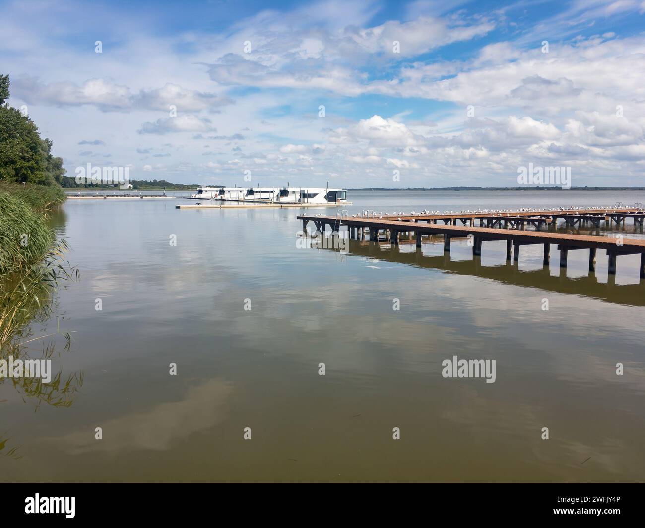 Landscape of Jamno lake with pier and modern houseboats in summer Stock ...