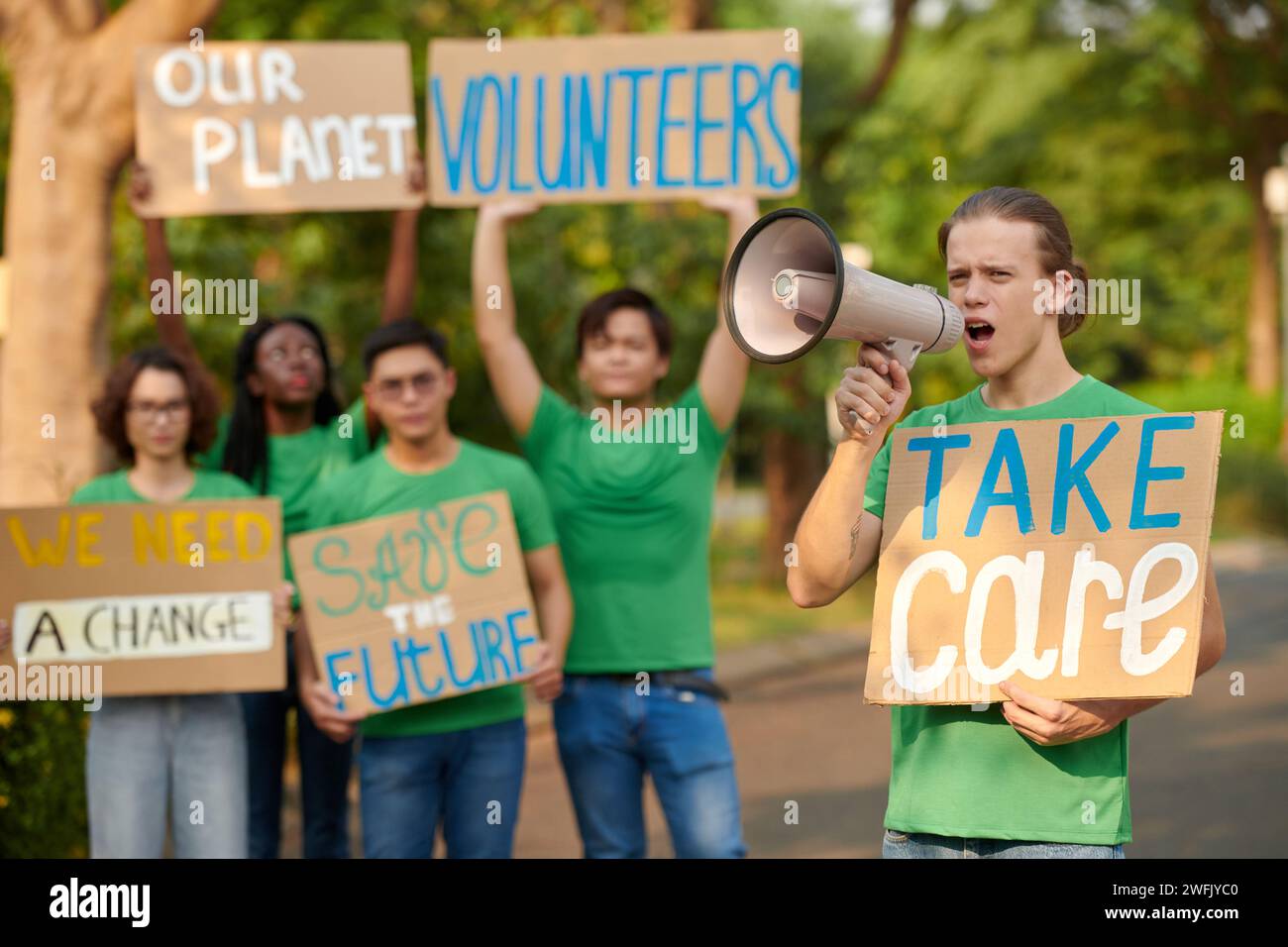 Group of activists encouraging others to be volunteers and care more ...